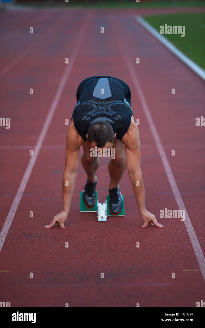 Athletic man start Stock Photo - Alamy