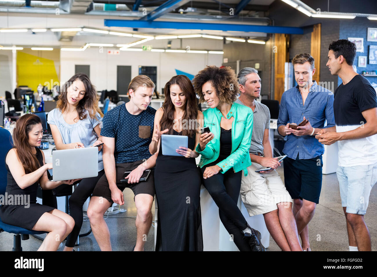 Group of colleagues talking in office Stock Photo - Alamy