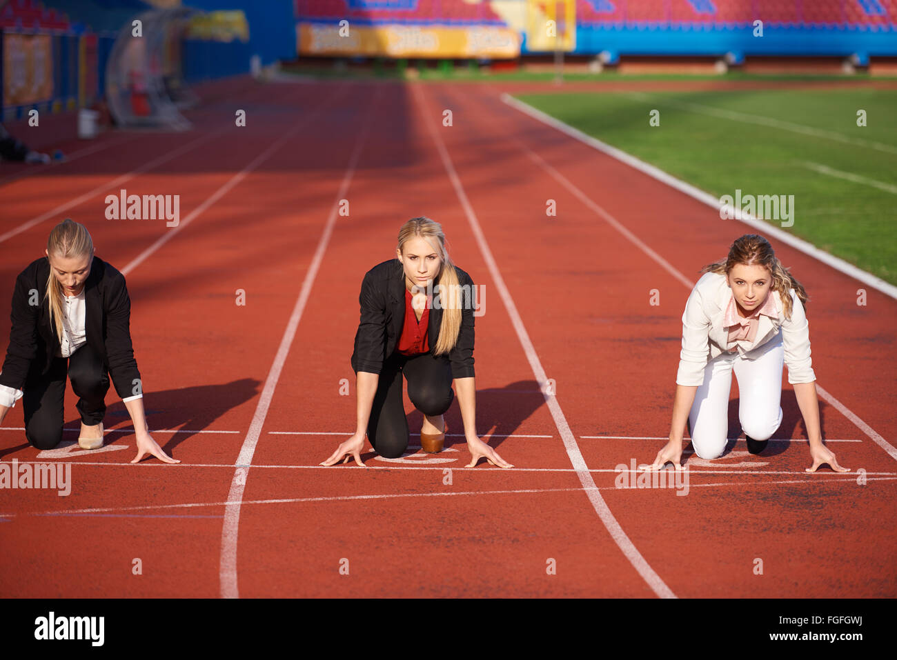 business people running on racing track Stock Photo - Alamy