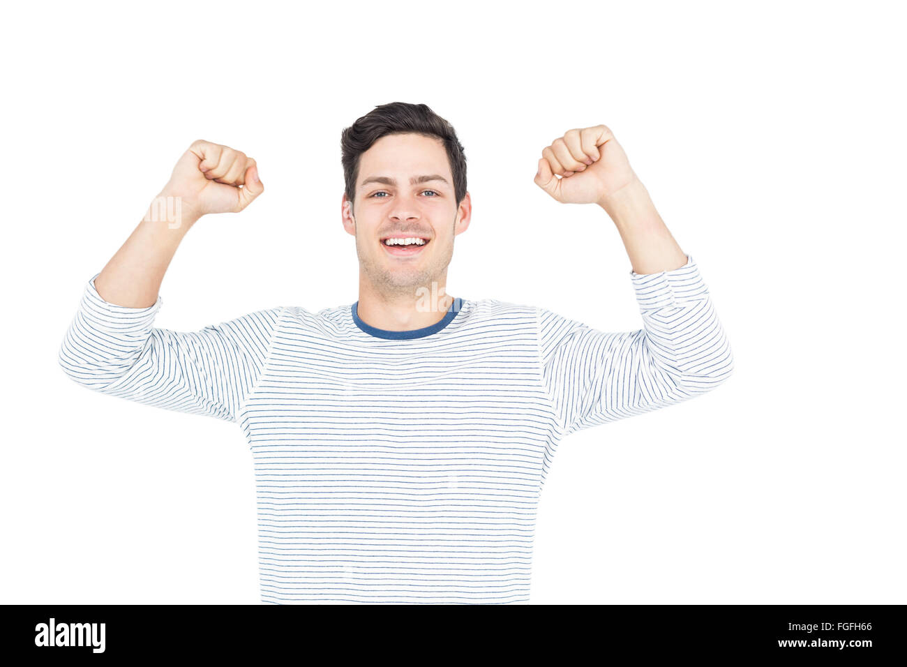 Triumphant man raising fist Stock Photo - Alamy