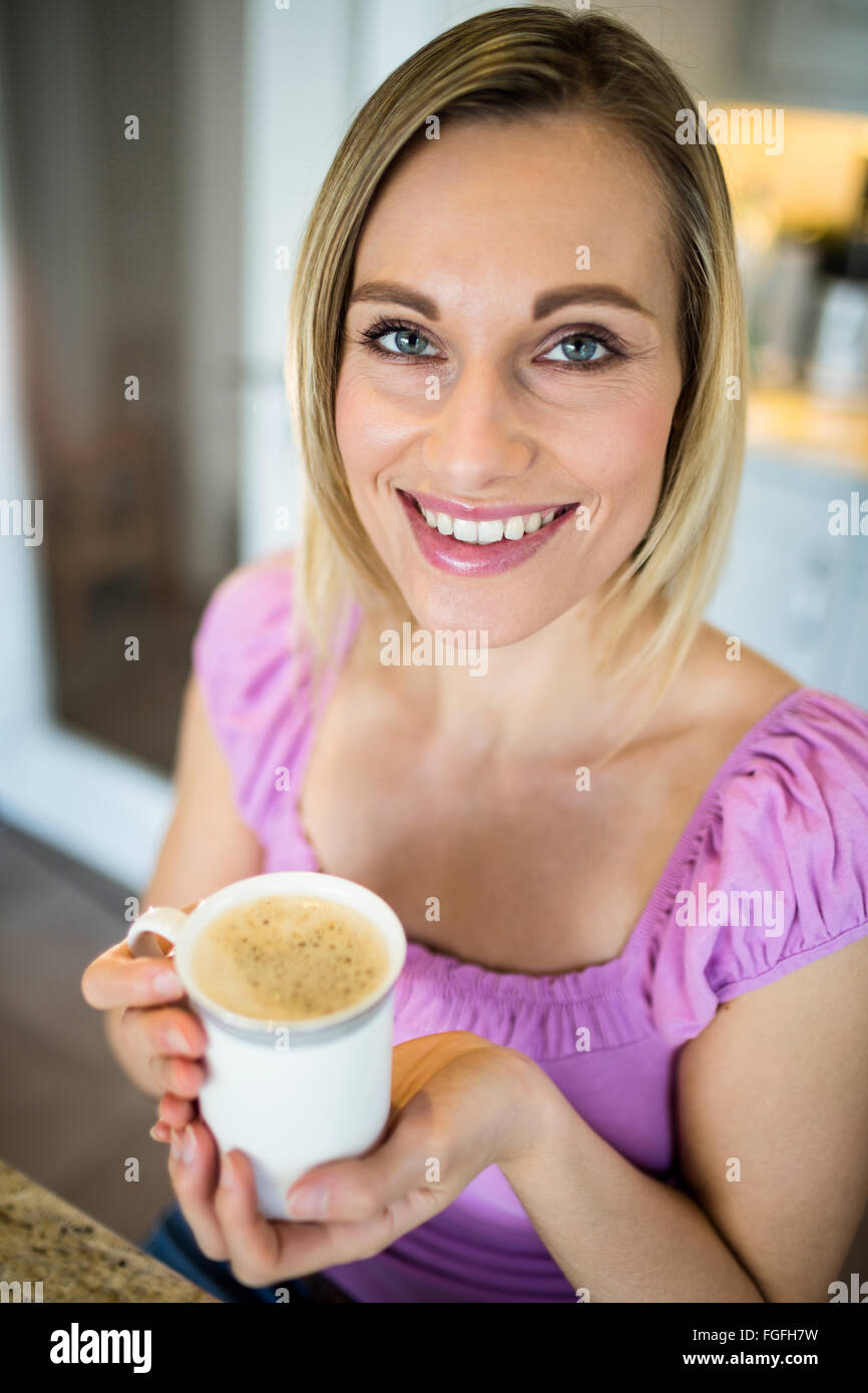 Pretty blonde woman having coffee Stock Photo - Alamy