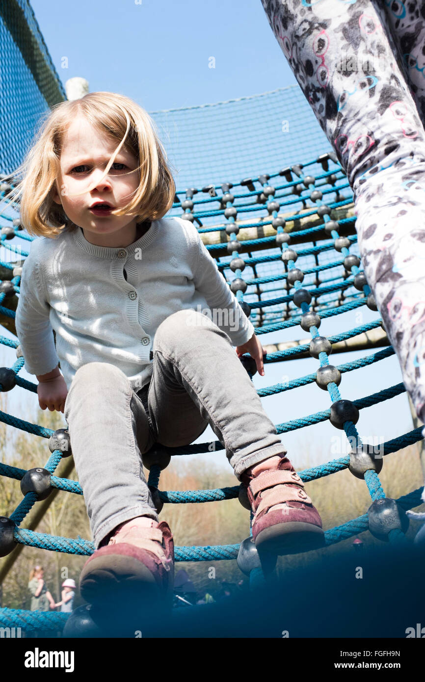 Climbing down from the climbing ropes Stock Photo - Alamy