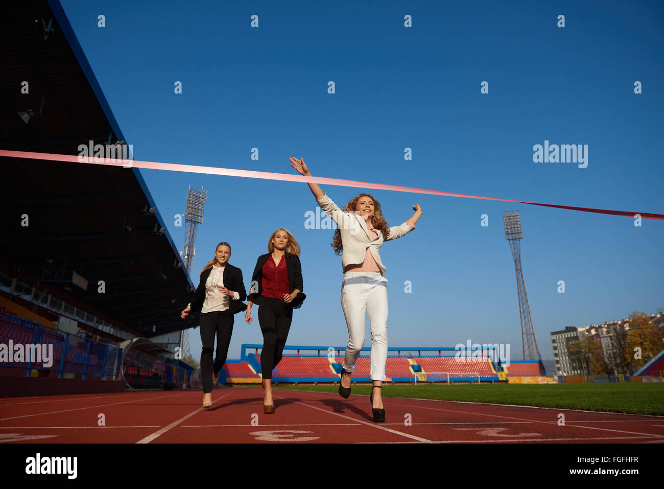 business people running on racing track Stock Photo - Alamy