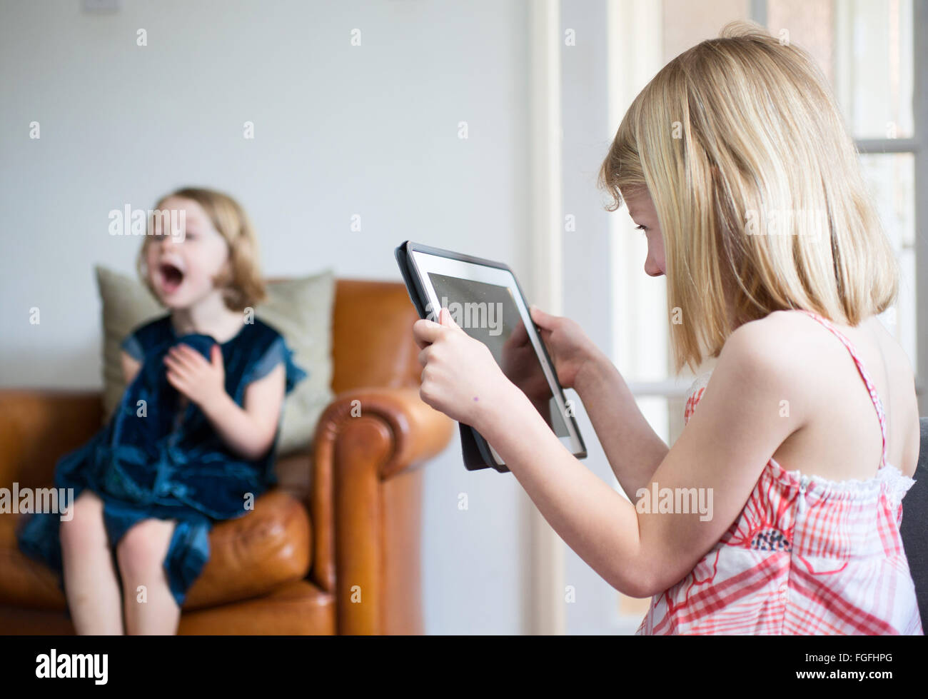 Girls on tablet home hi-res stock photography and images - Alamy