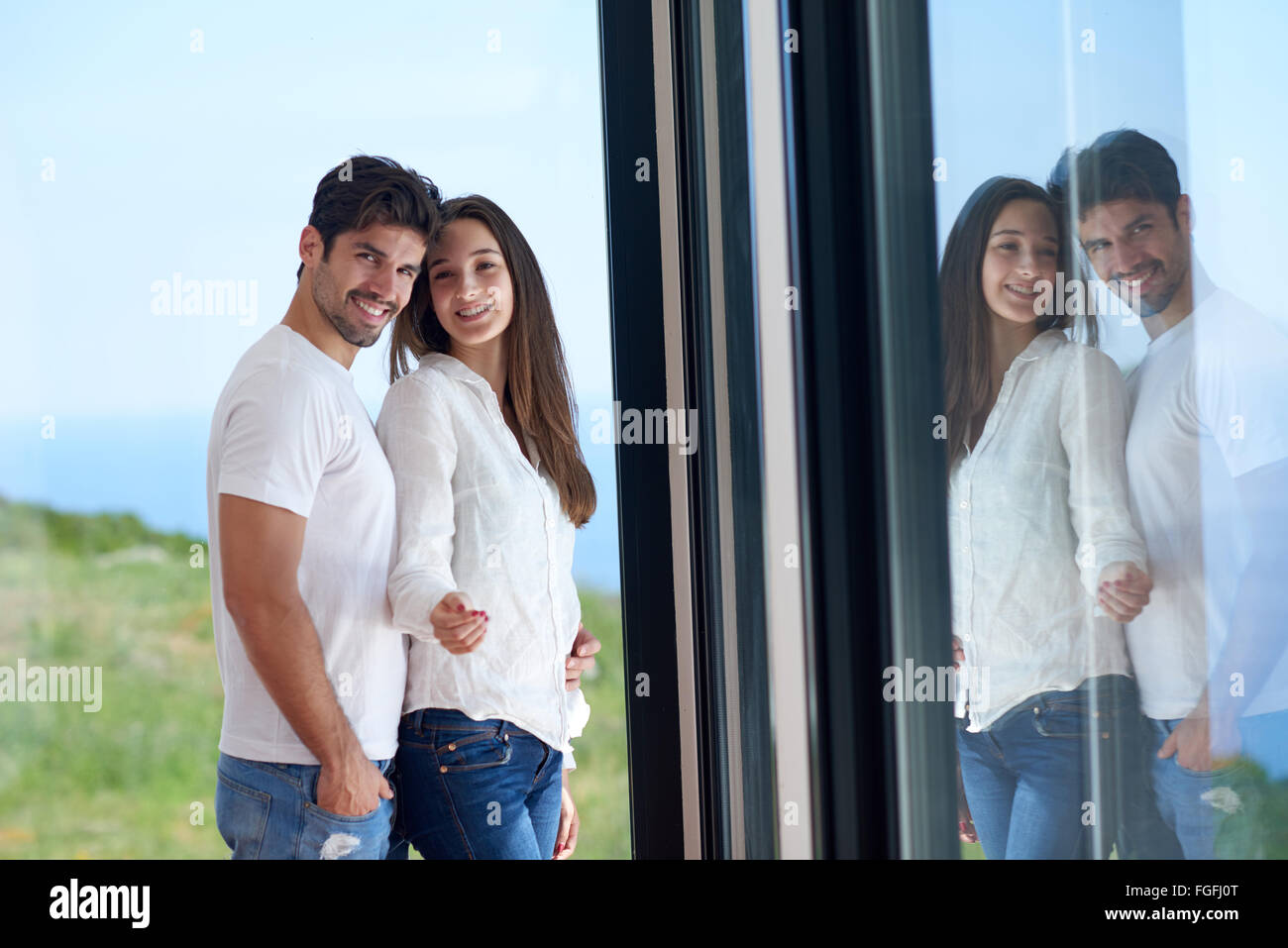 relaxed young couple at home staircase Stock Photo - Alamy
