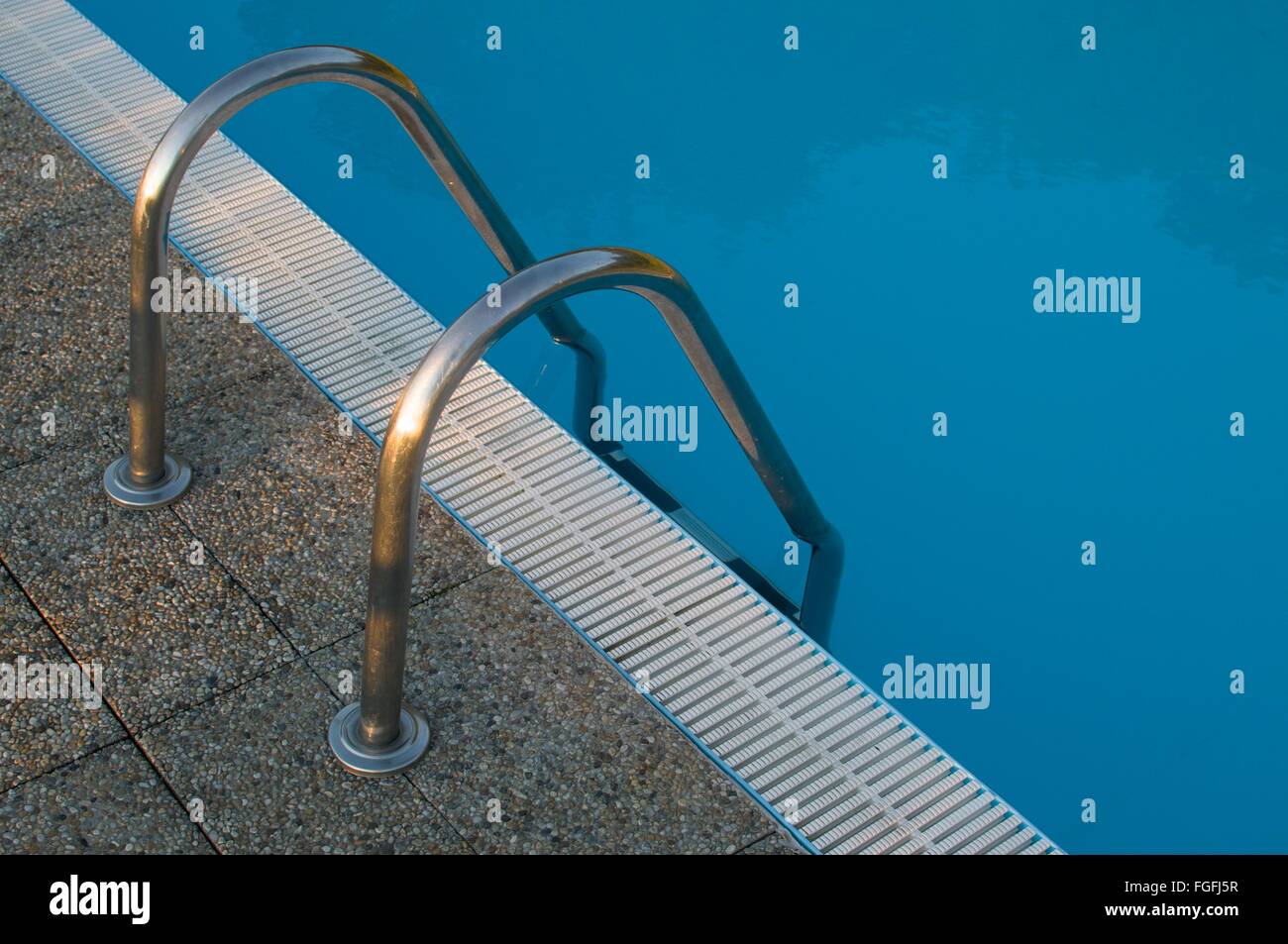Swimming pool stairs with handrails Stock Photo - Alamy