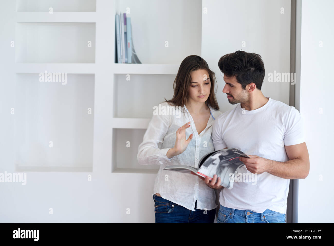 relaxed young couple at home staircase Stock Photo - Alamy