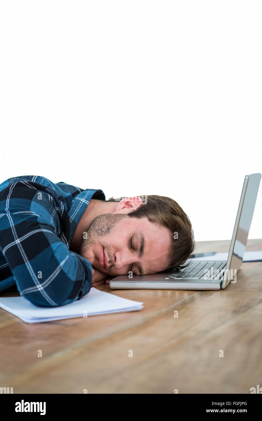 Handsome man sleeping on laptop Stock Photo - Alamy
