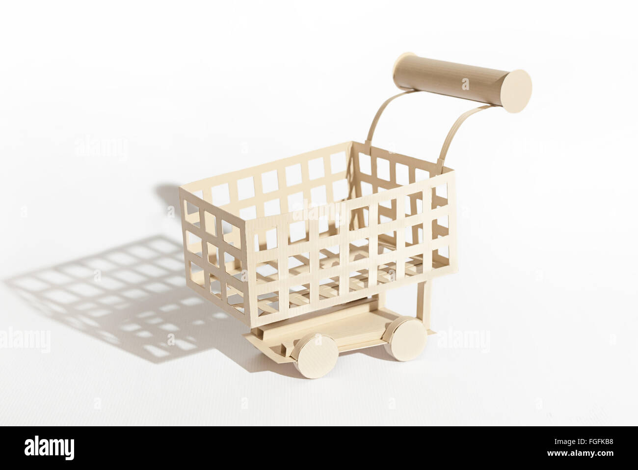 Shopping cart cut out of paper with shadow Stock Photo - Alamy