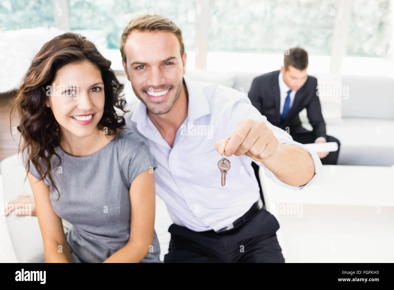 Happy young couple holding new house key Stock Photo - Alamy