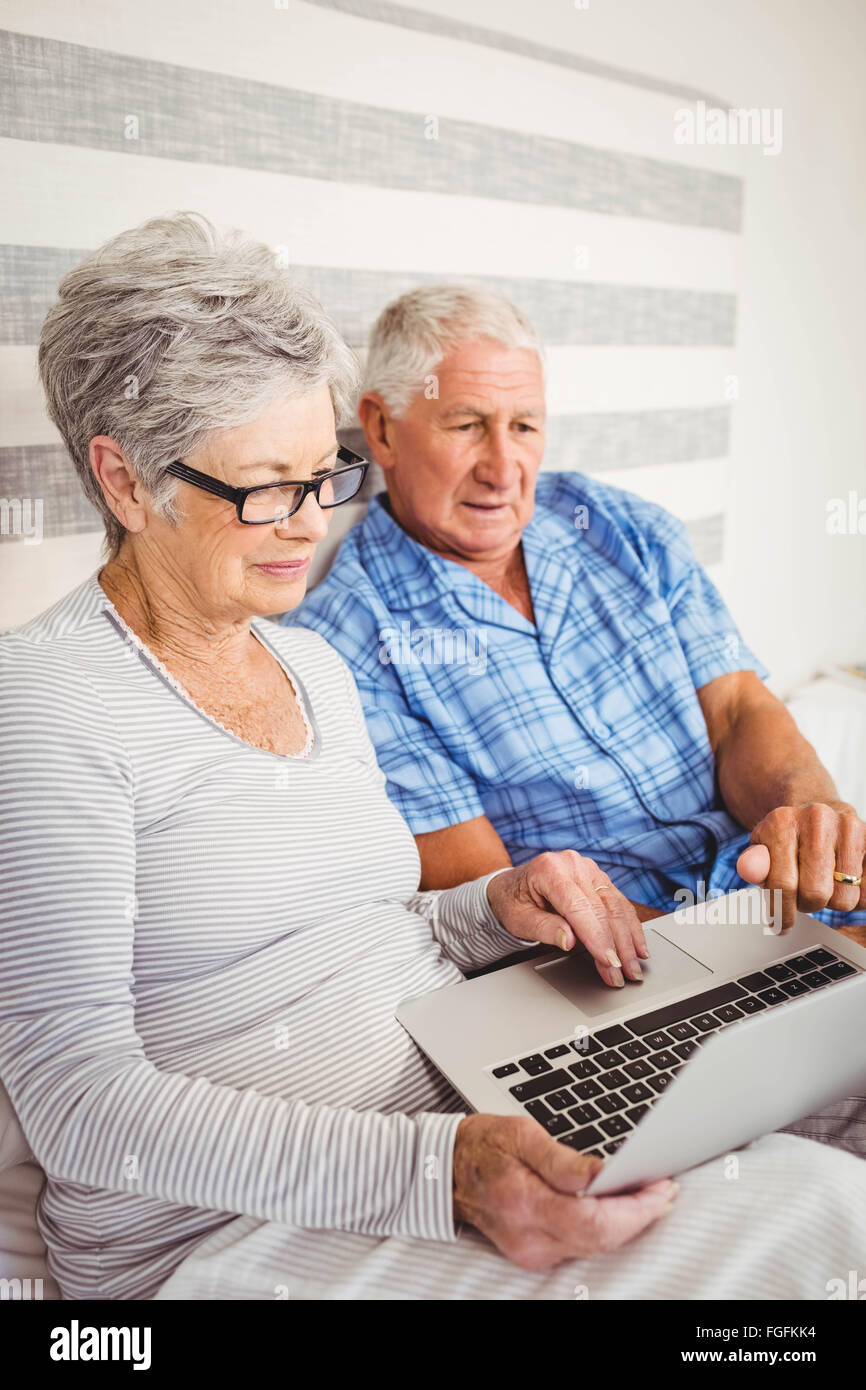 Senior couple using laptop Stock Photo - Alamy