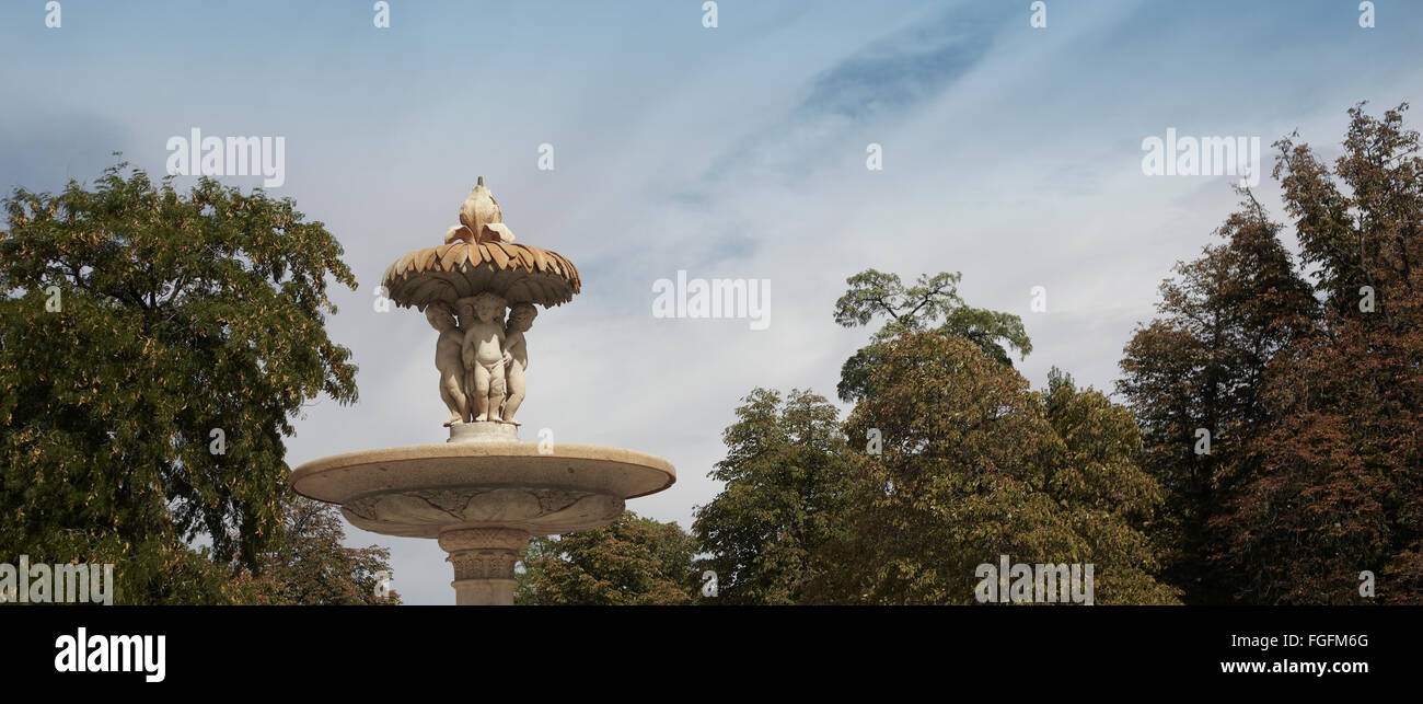 Antique fountain detail with trees and sky. Horizontal Stock Photo - Alamy