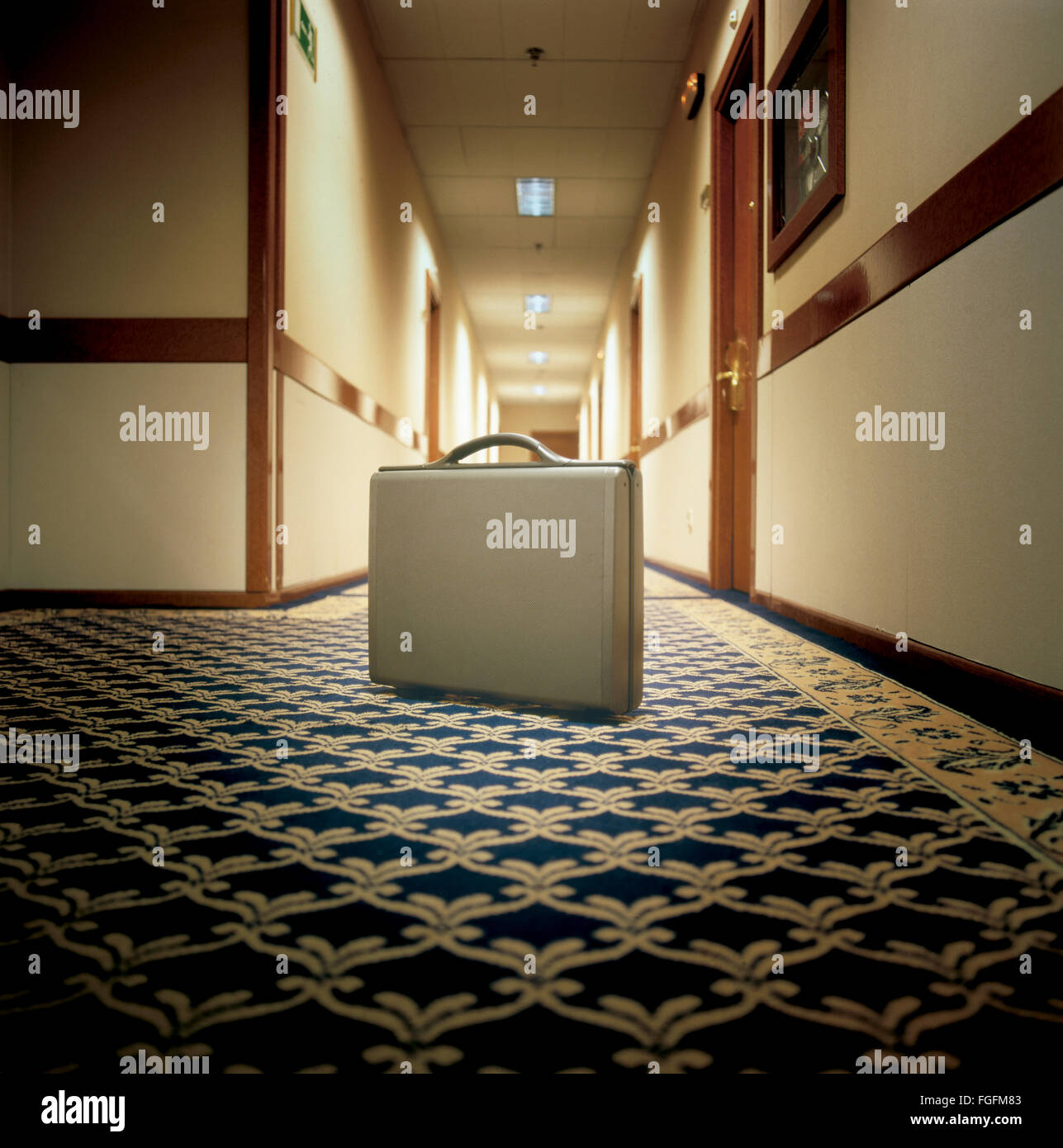 Modern briefcase in a hotel corridor. Square format Stock Photo - Alamy