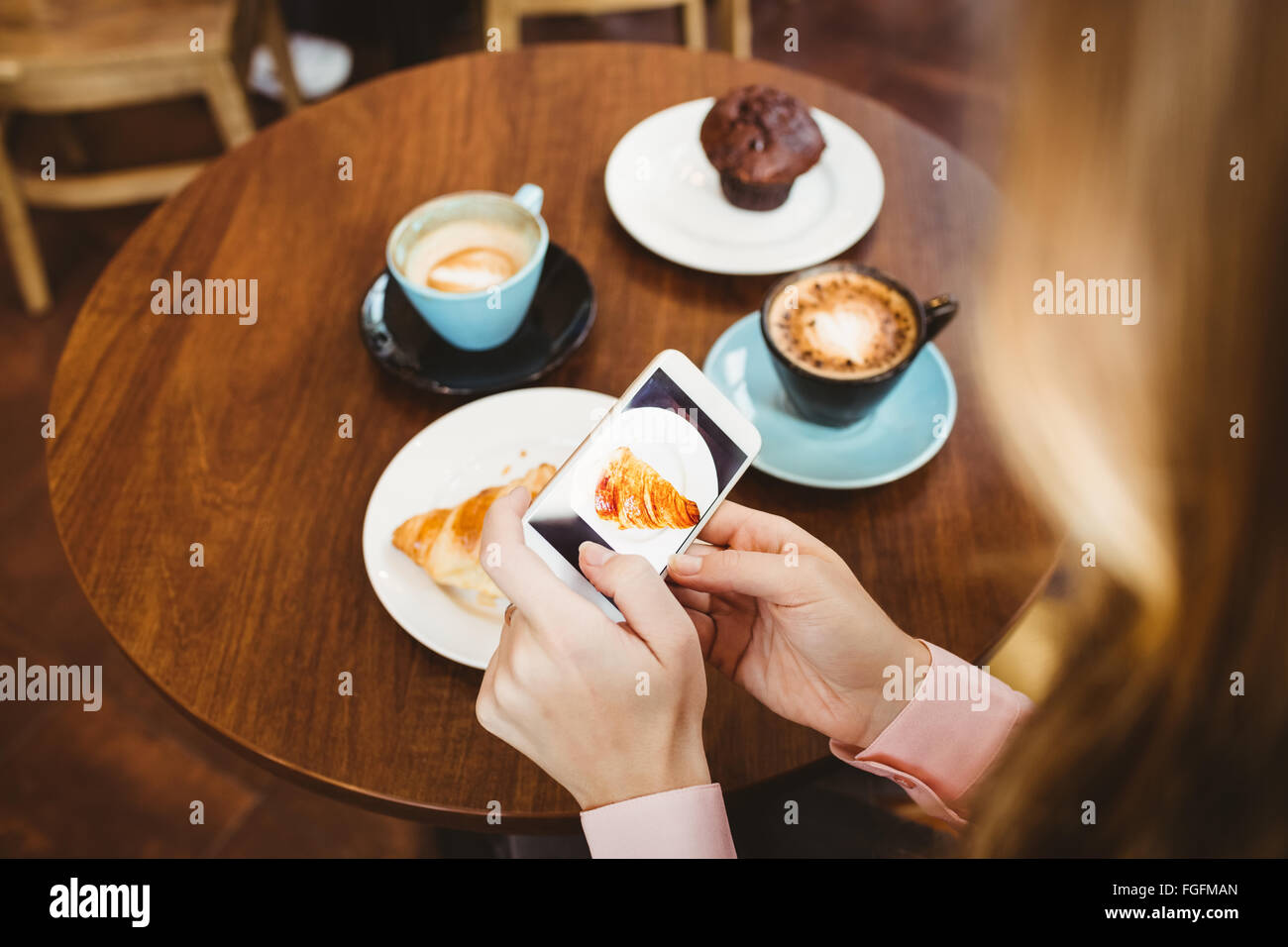 Woman taking picture of food Stock Photo - Alamy