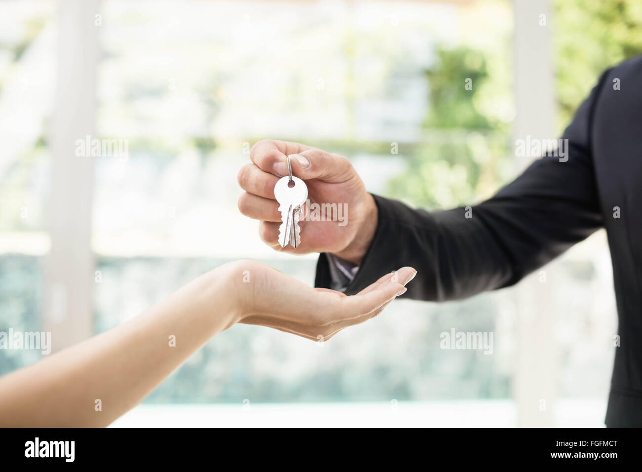 Real-estate agent giving keys Stock Photo - Alamy