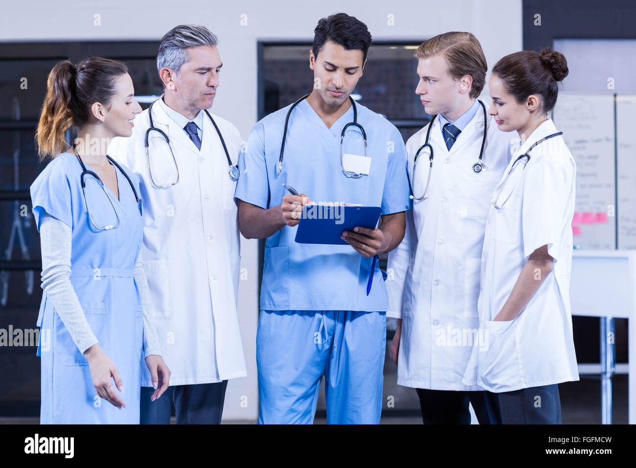 Medical team discussing together Stock Photo - Alamy