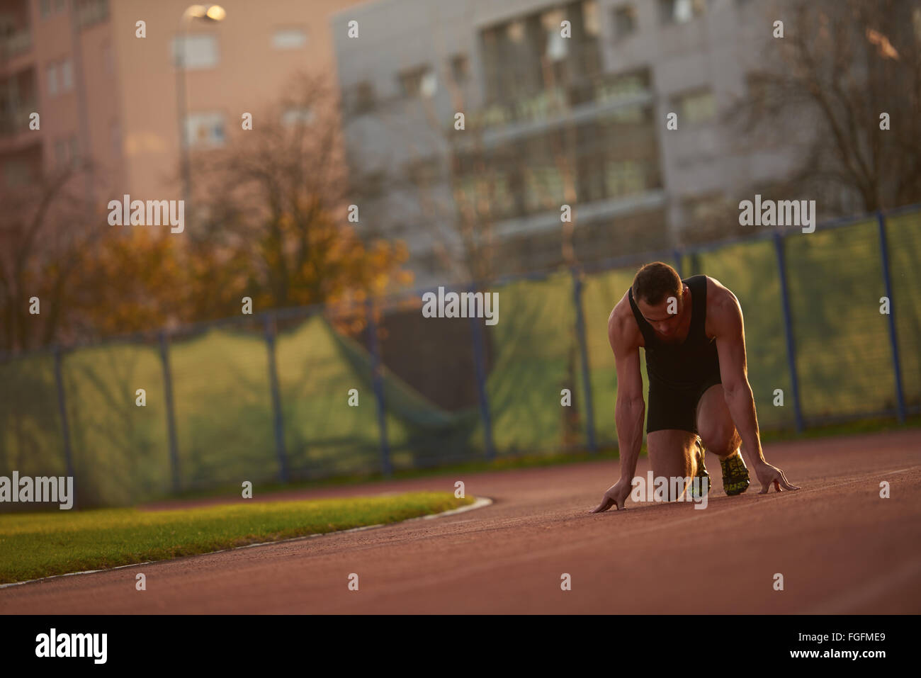 Athletic man start Stock Photo - Alamy