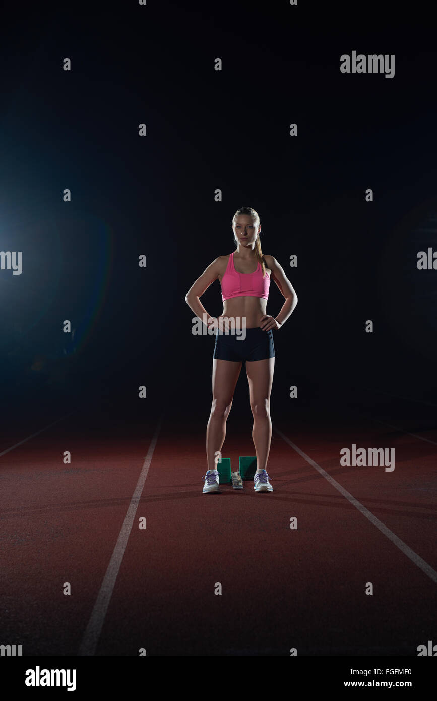 Female sprinter leaving starting blocks hi-res stock photography and ...