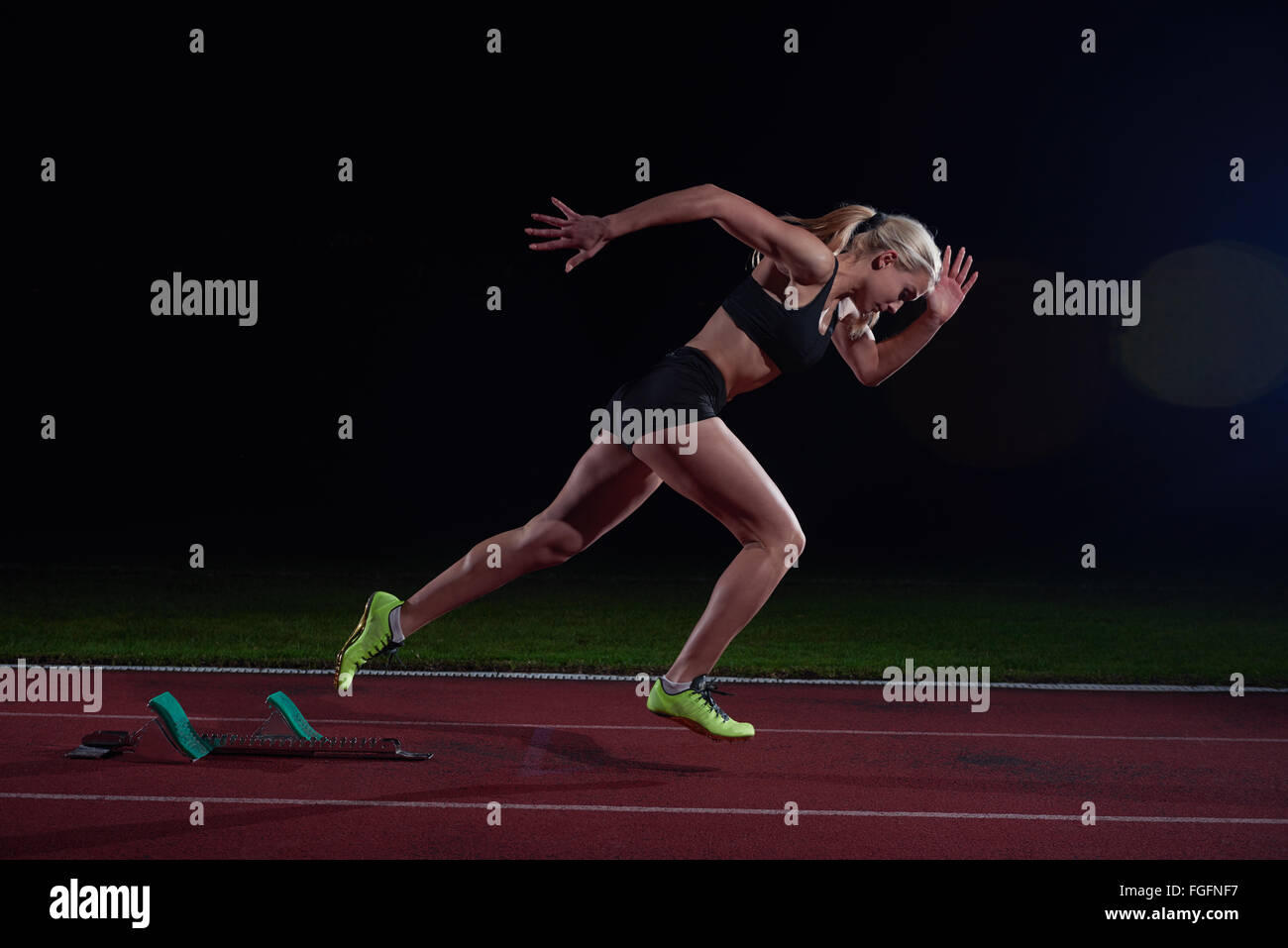 Female sprinter leaving starting blocks hi-res stock photography and ...