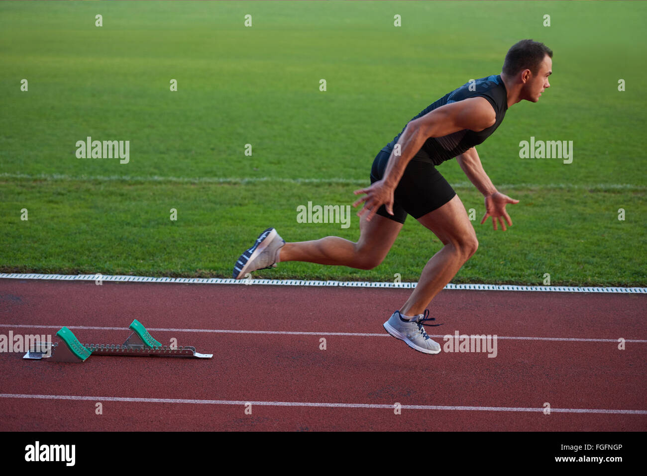 Athletic man start Stock Photo - Alamy