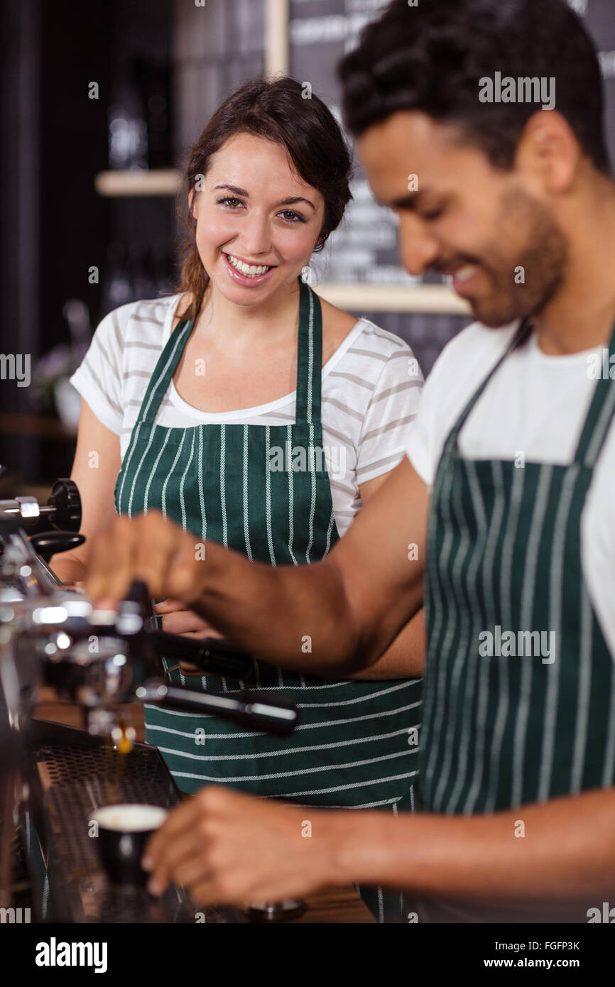 Smiling baristas working Stock Photo - Alamy