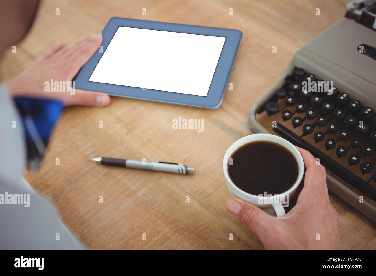 Man using old typewriter and tablet Stock Photo - Alamy