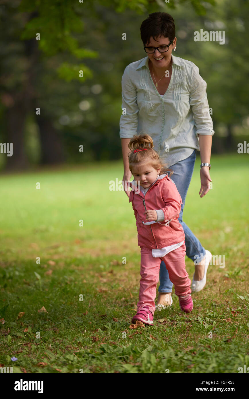 happy family playing together outdoor in park Stock Photo - Alamy