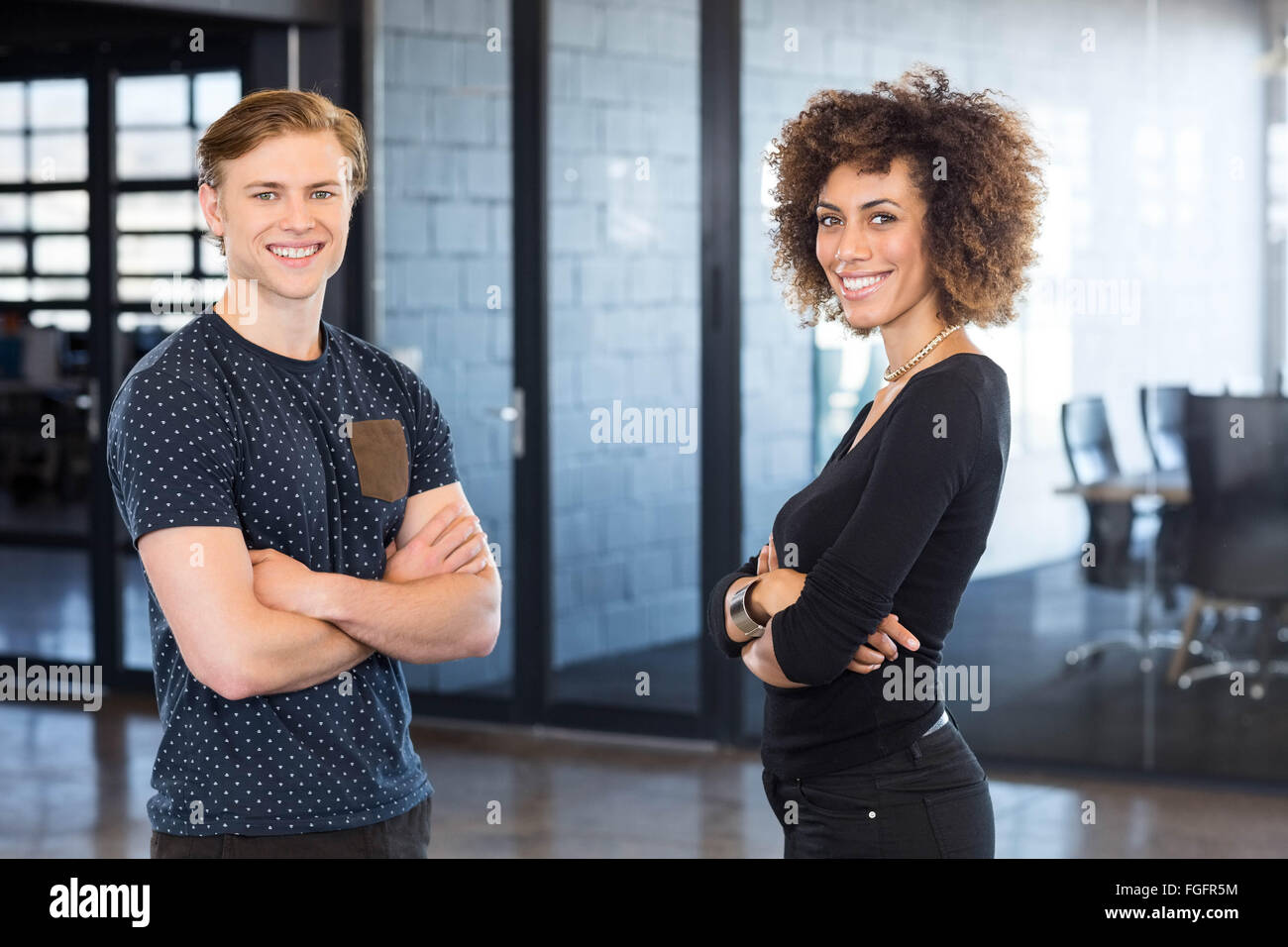 Portrait of business executives standing together in office Stock Photo ...