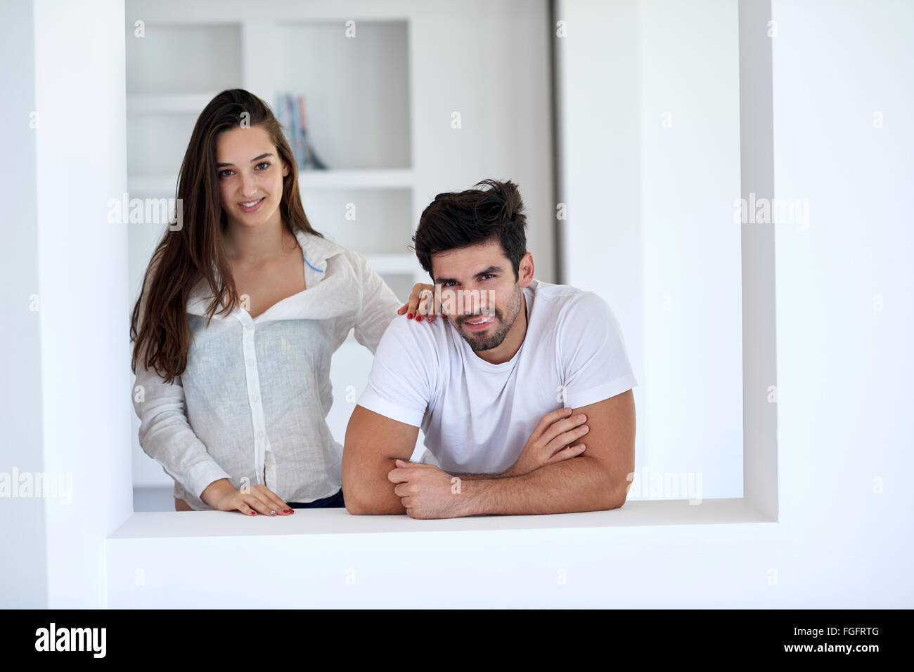 relaxed young couple at home staircase Stock Photo - Alamy