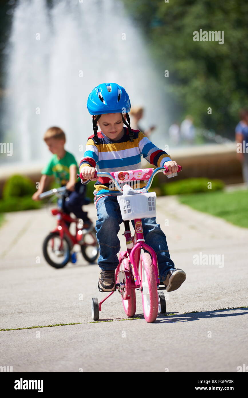 happy boy learning to ride his first bike Stock Photo - Alamy