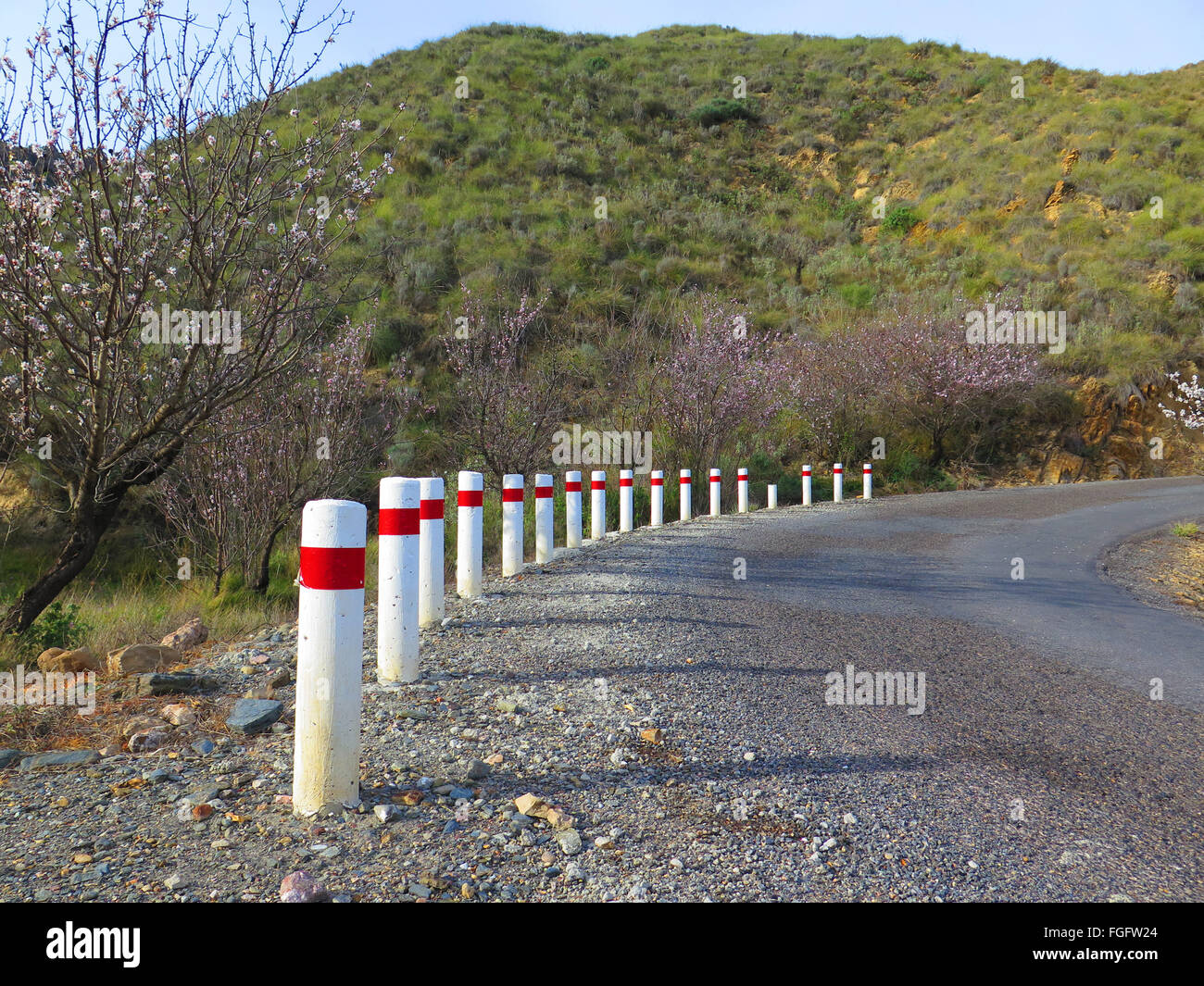 Curve with White and red road bollards Stock Photo - Alamy