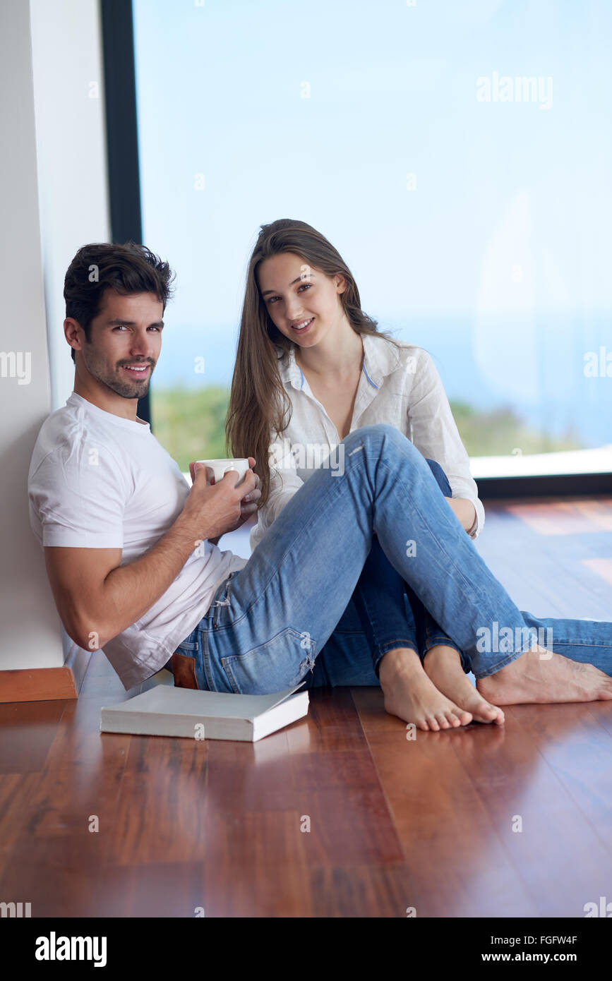 relaxed young couple at home staircase Stock Photo - Alamy