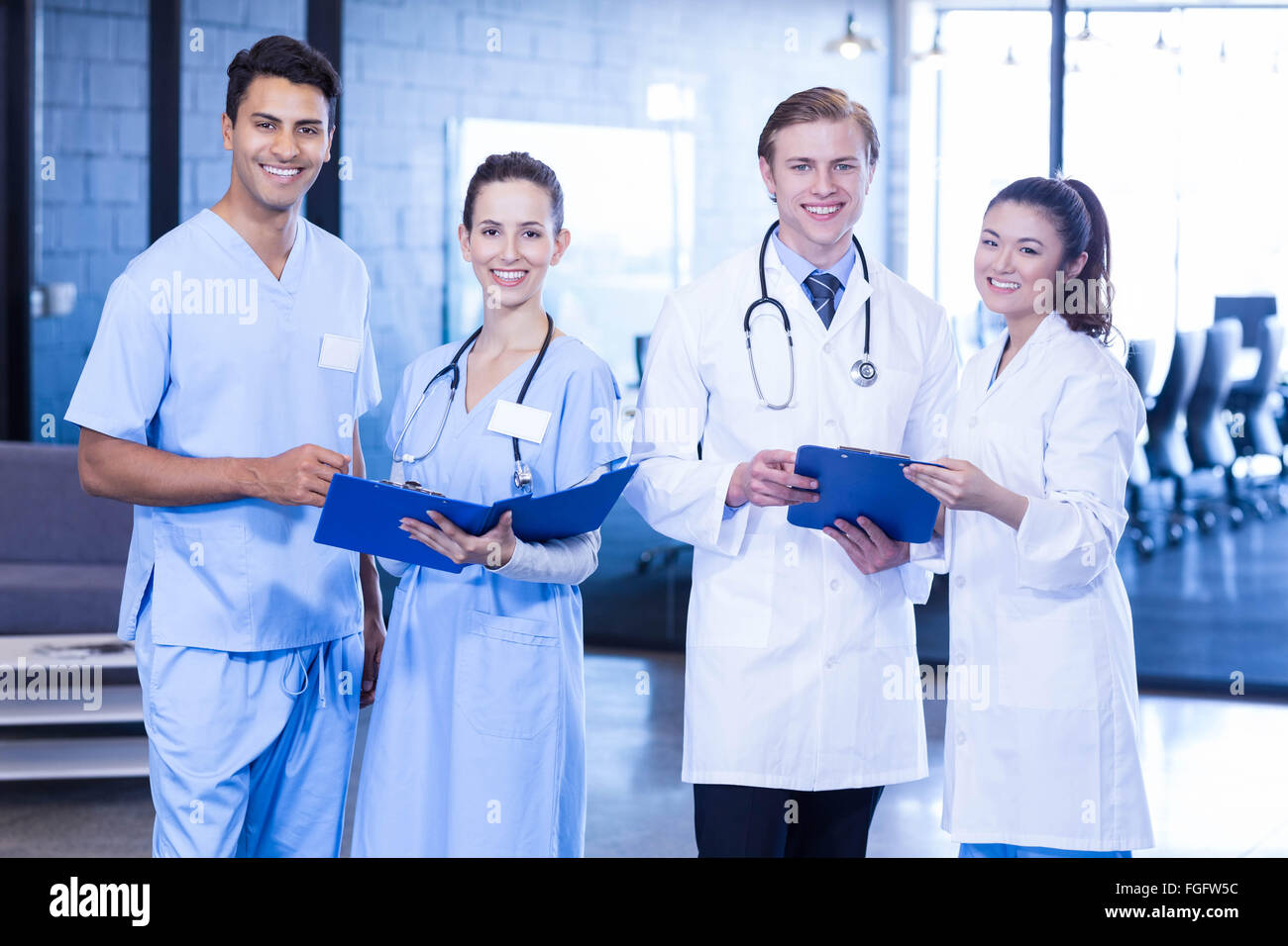Doctors looking at medical report Stock Photo - Alamy
