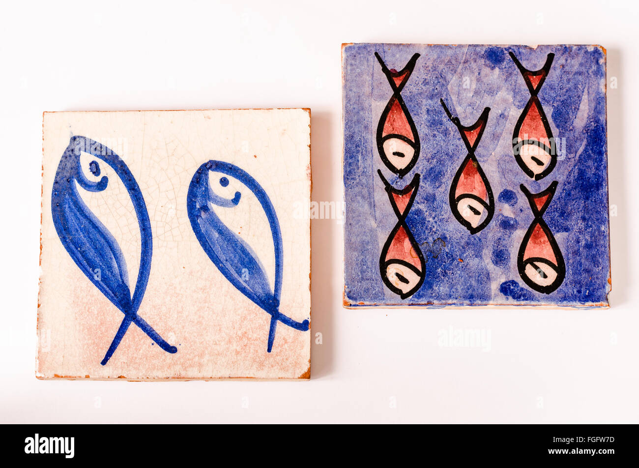 tiles with fishes drawing on it over white Stock Photo - Alamy
