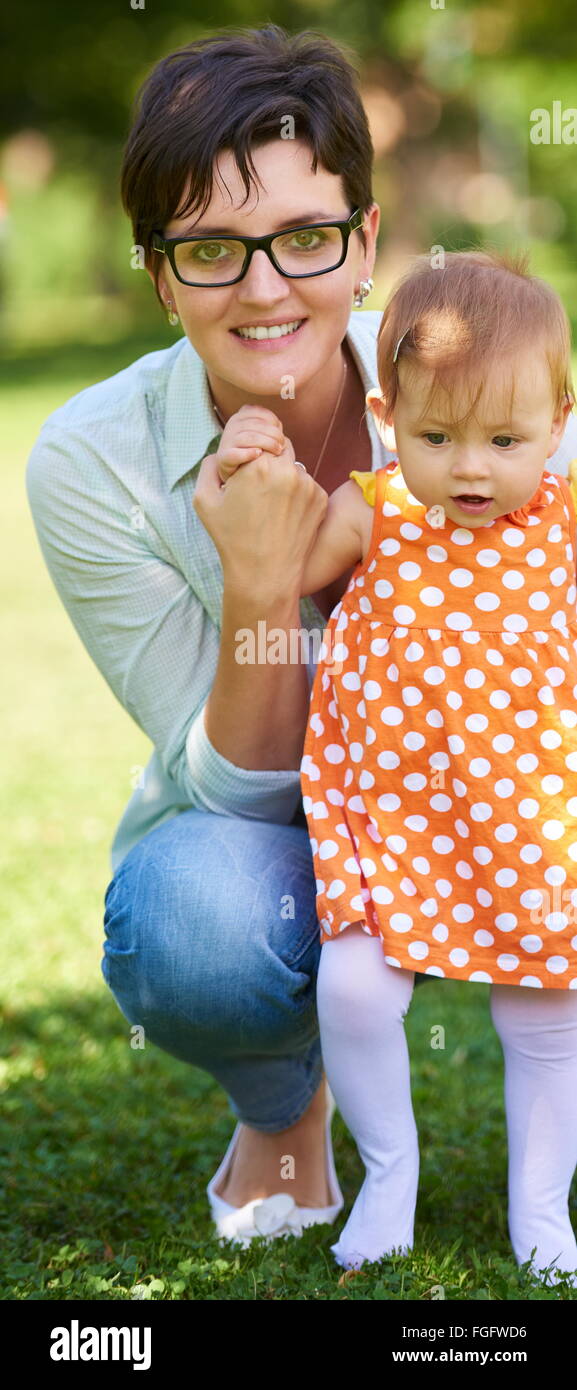 mother and baby in park making first steps Stock Photo - Alamy