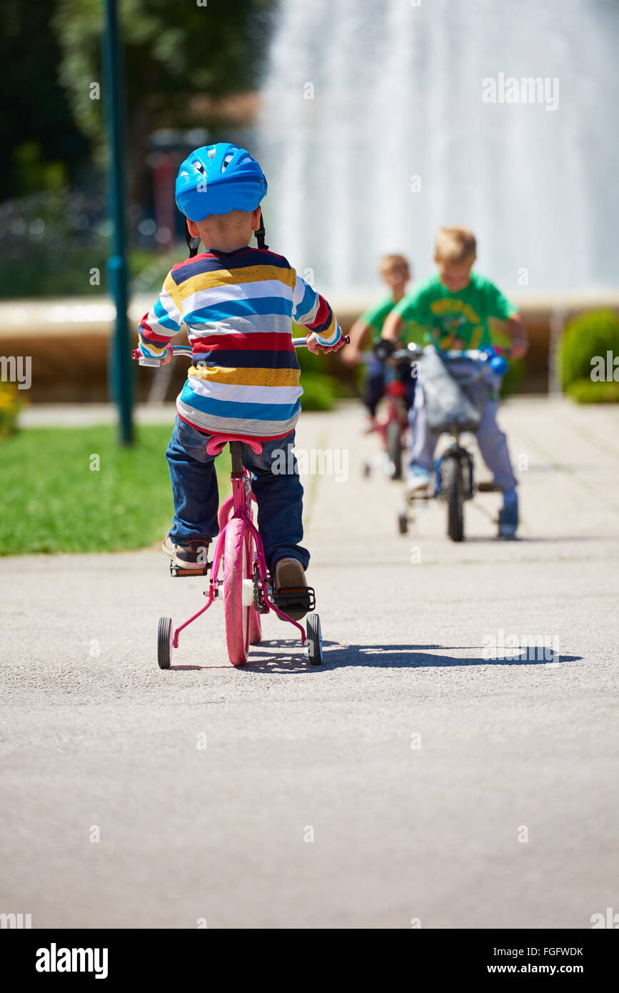 happy boy learning to ride his first bike Stock Photo - Alamy