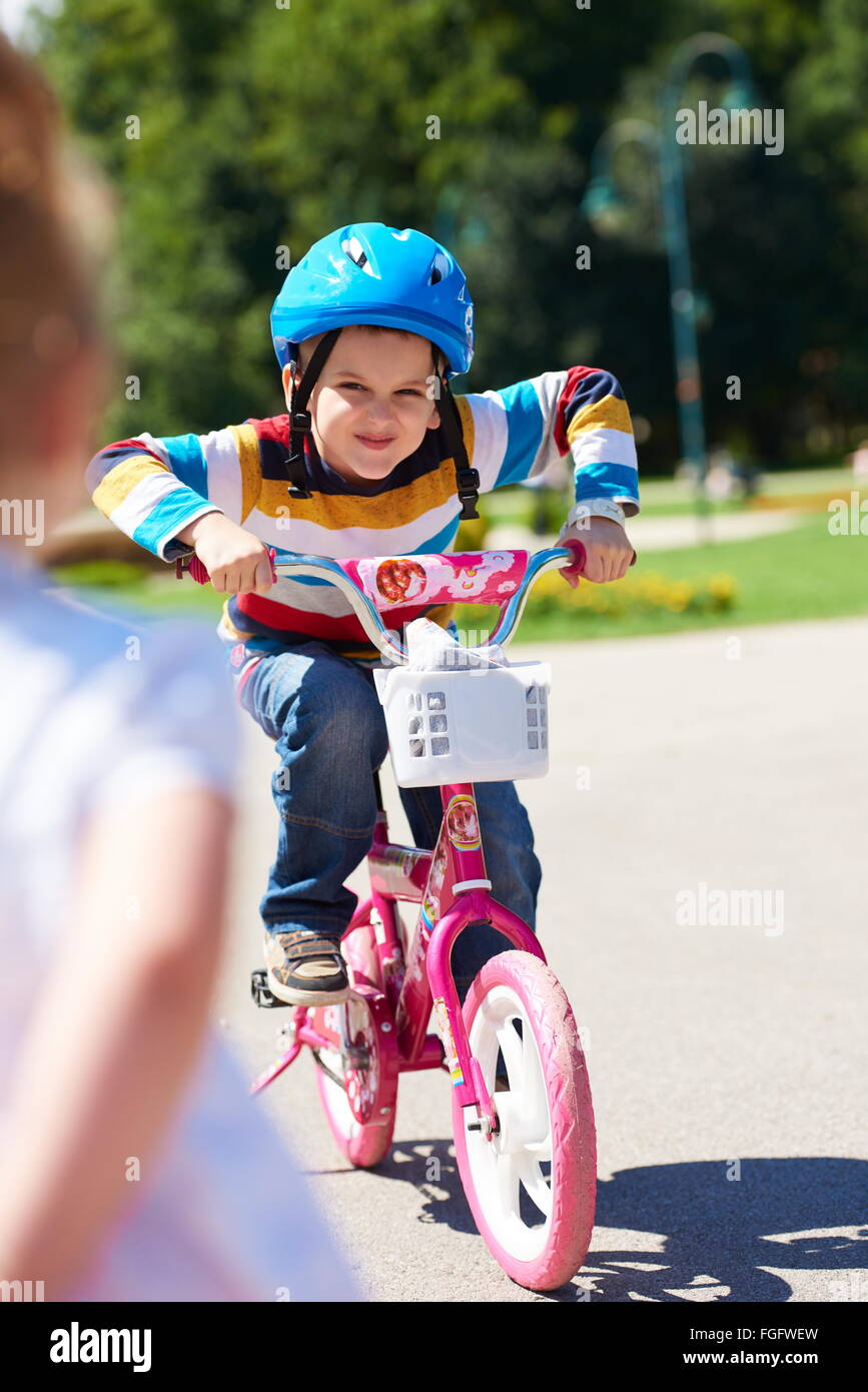 happy boy learning to ride his first bike Stock Photo - Alamy