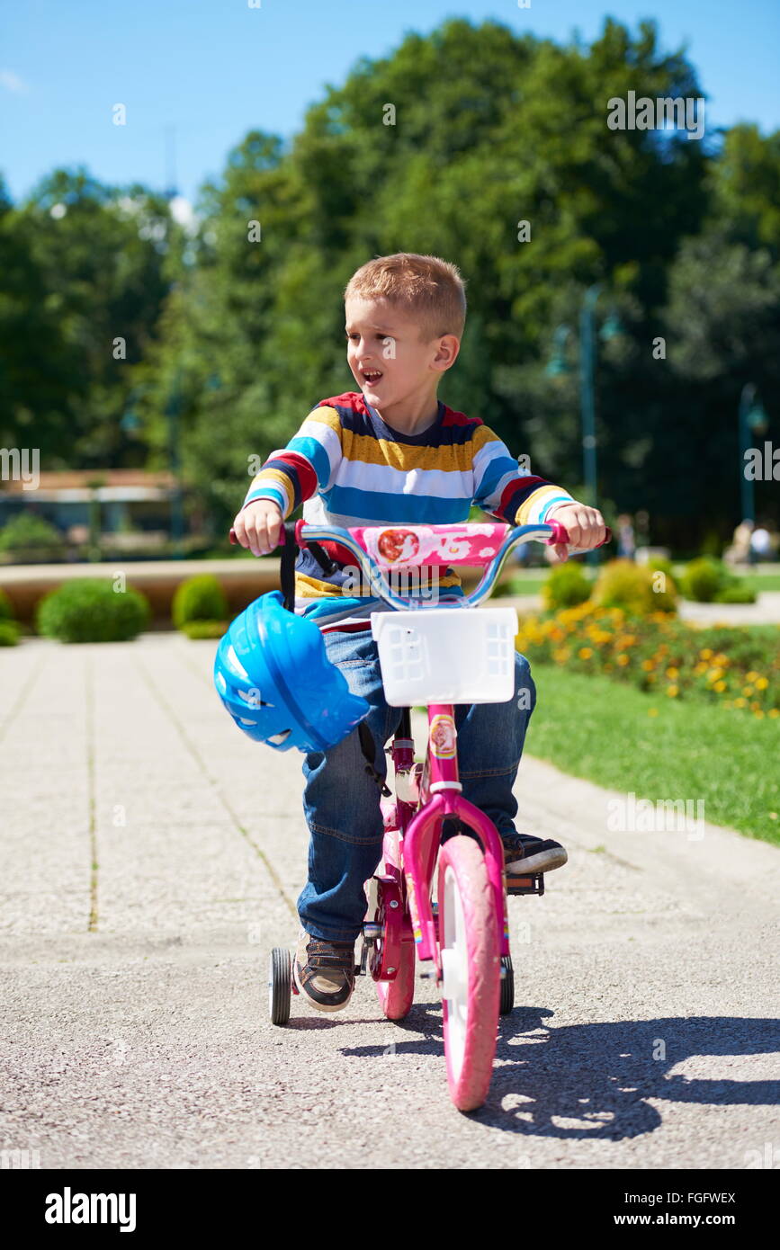 happy boy learning to ride his first bike Stock Photo - Alamy