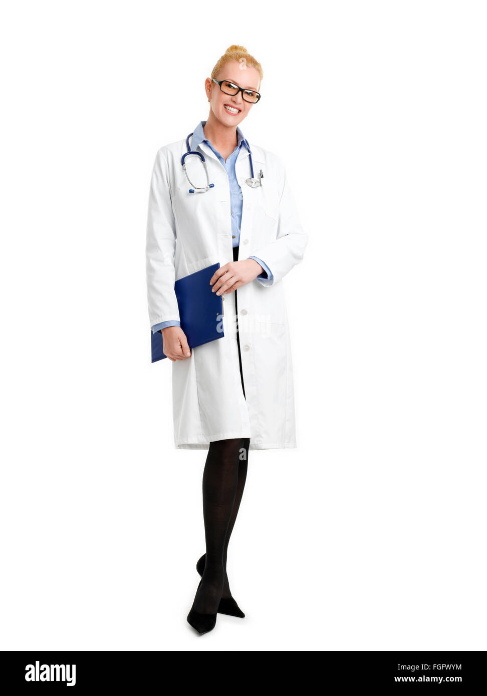 Full length portrait of female doctor standing agains white background ...