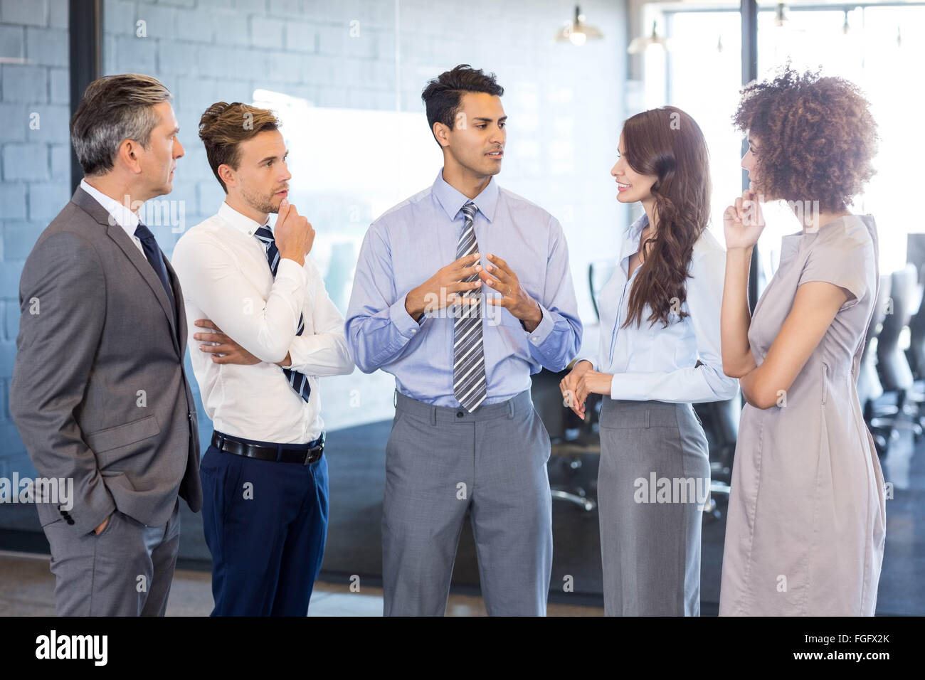 Business team interacting in office Stock Photo - Alamy