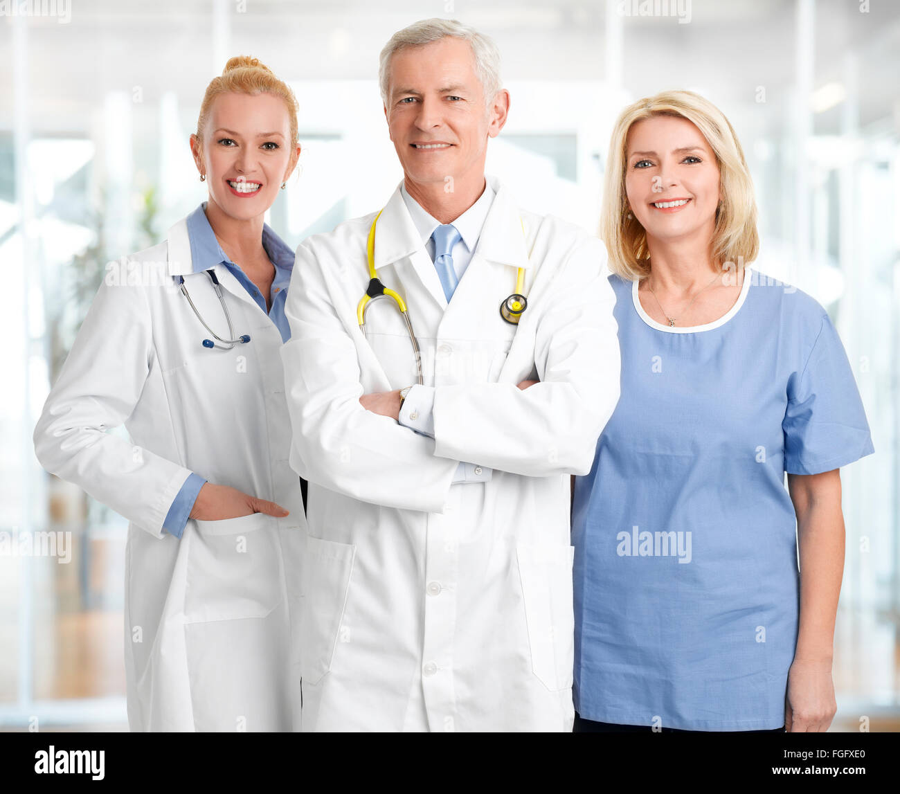 Portrait of successful medical staff standing at private clinic Stock ...