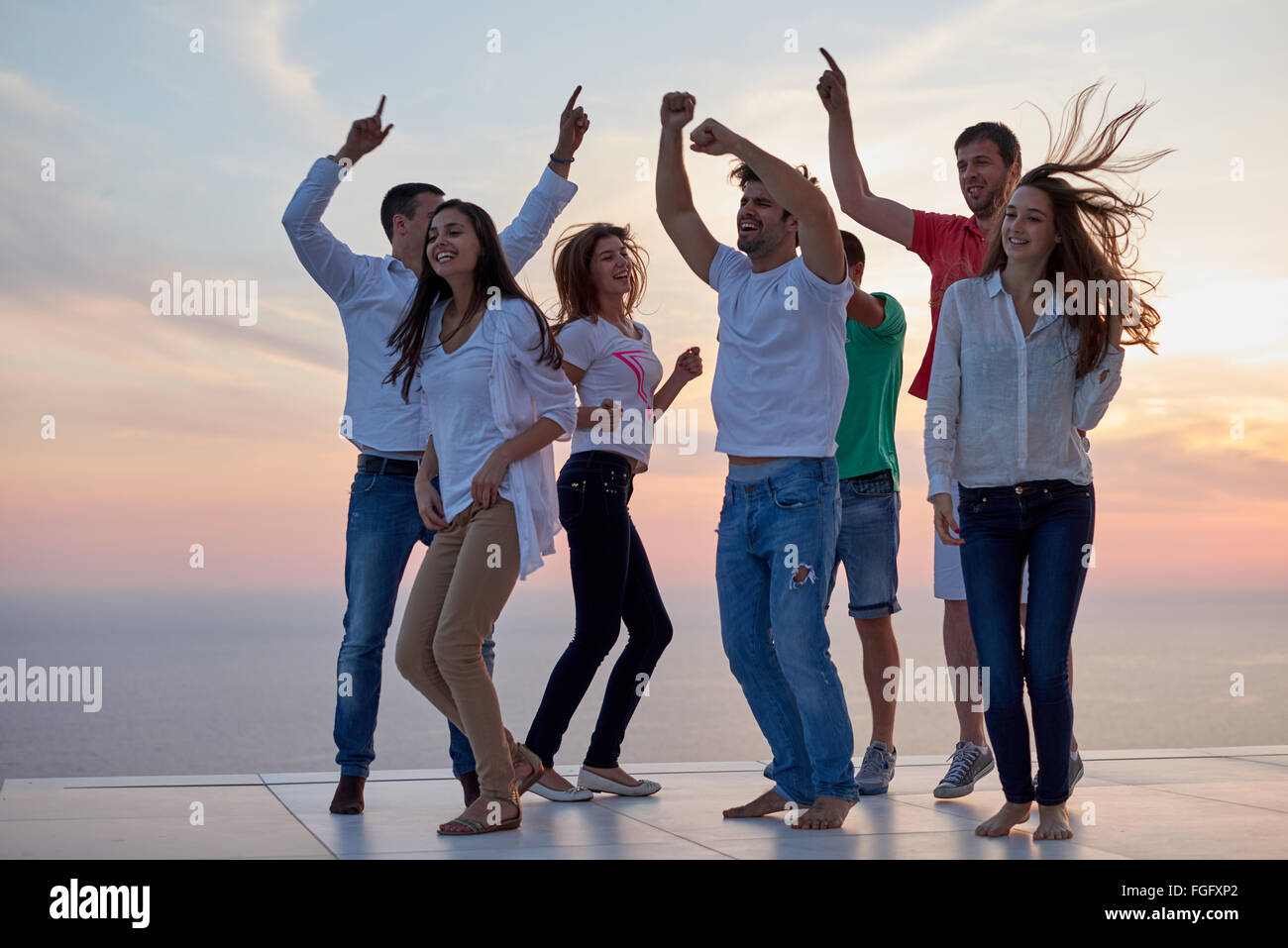party people on sunset Stock Photo - Alamy