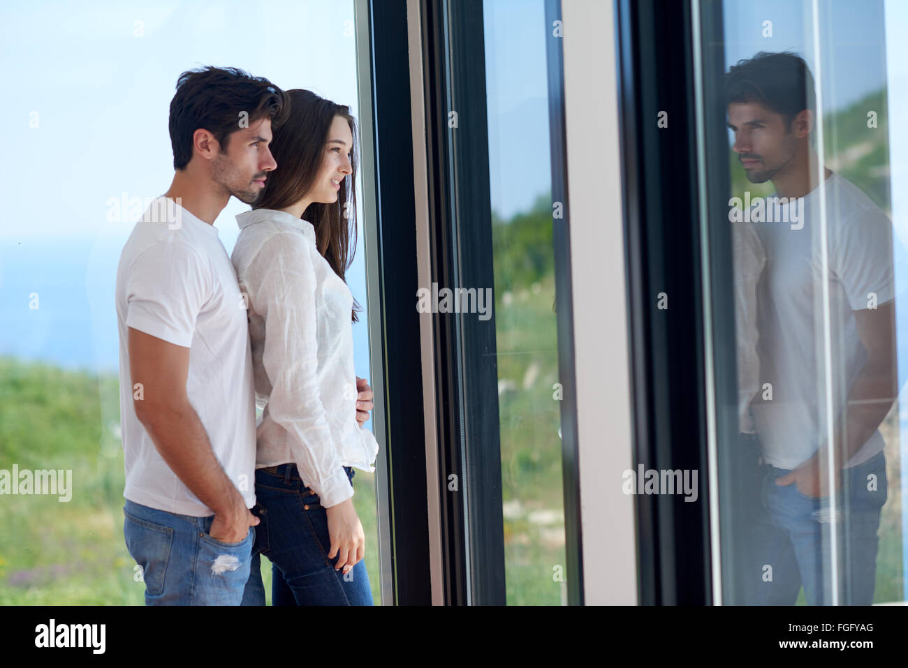relaxed young couple at home staircase Stock Photo - Alamy
