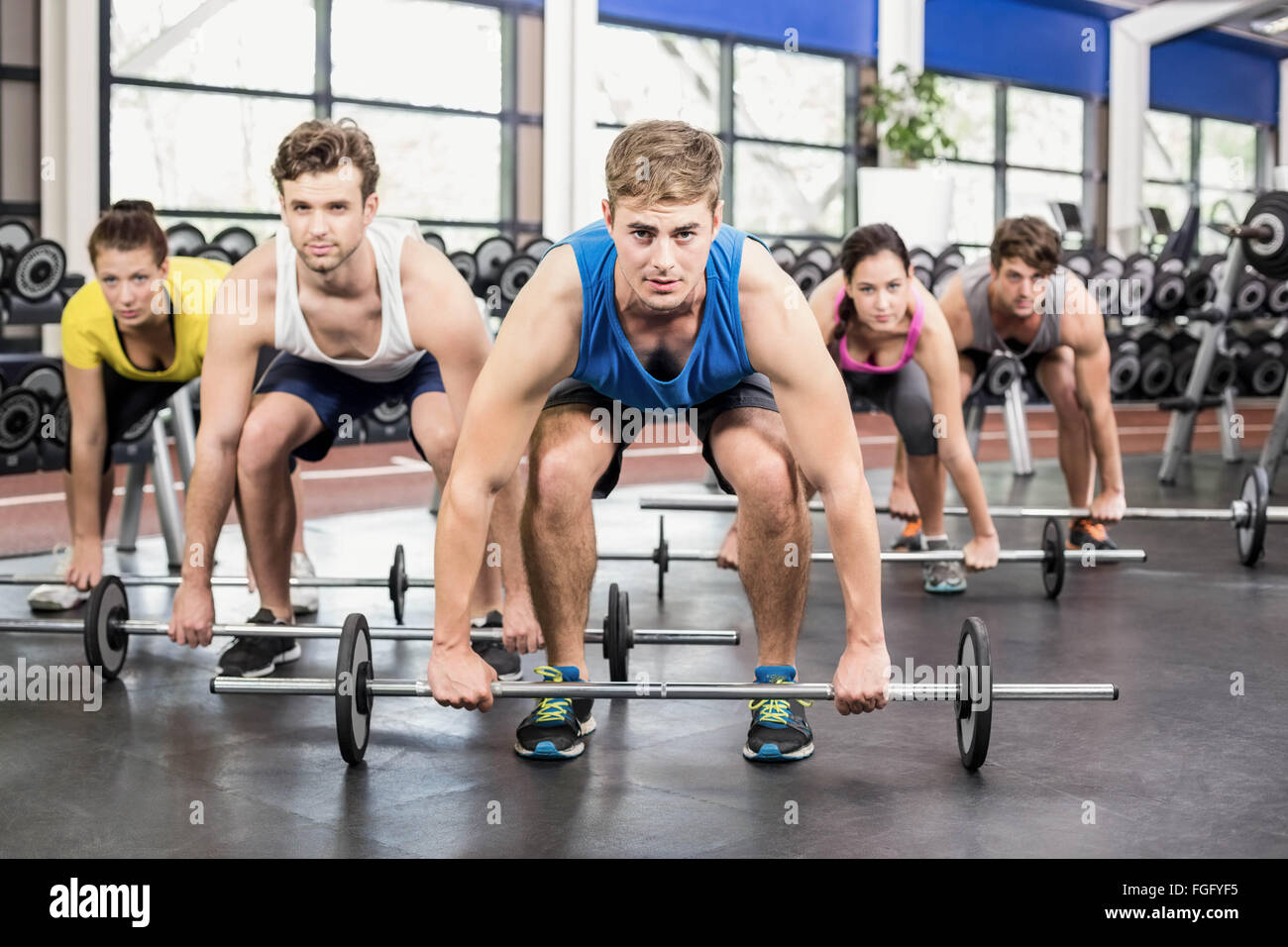 Athletic men and women working out Stock Photo - Alamy