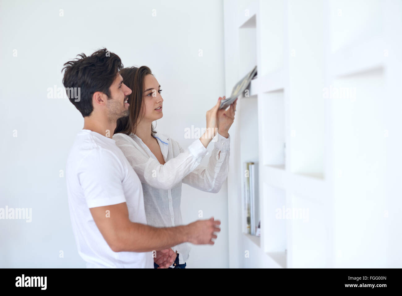 relaxed young couple at home staircase Stock Photo - Alamy
