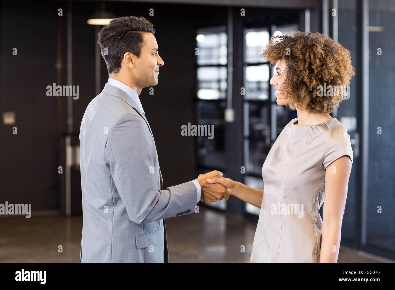 Indian woman shaking hands hi-res stock photography and images - Alamy