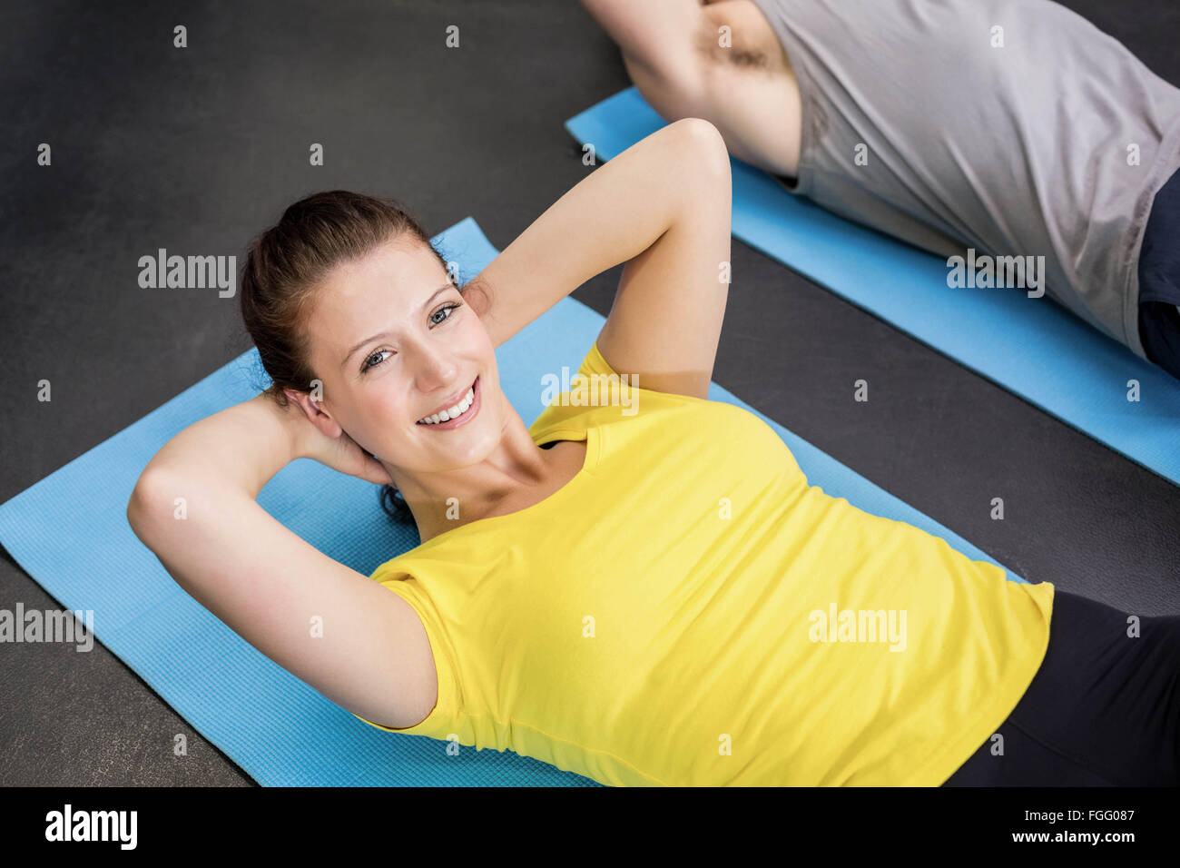 Pretty woman working her abs Stock Photo - Alamy