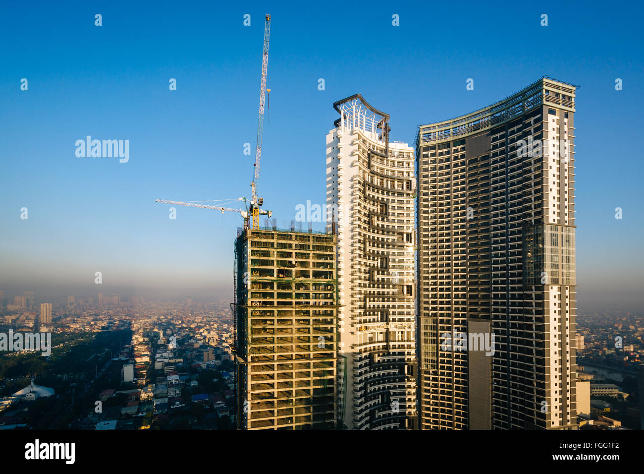 Skyscrapers and a building under construction in Makati, Metro Manila ...