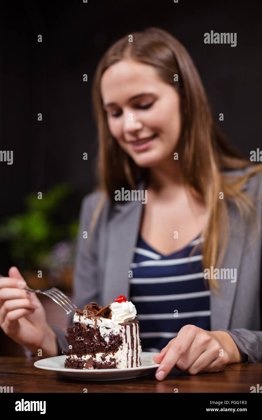 Pretty woman about to eat pie Stock Photo - Alamy