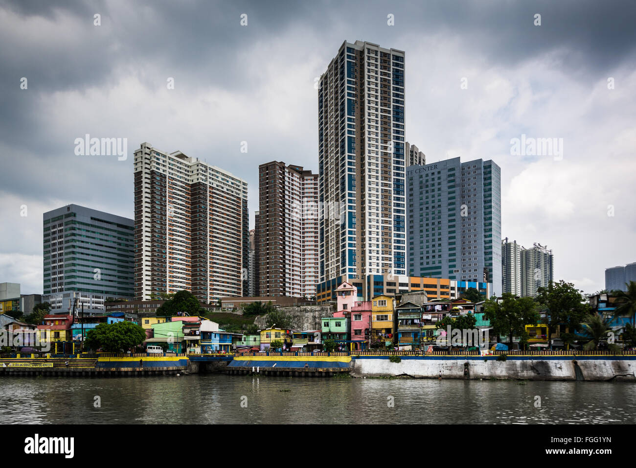 Buildings in Mandaluyong and the Pasig River, in Makati, Metro Manila ...